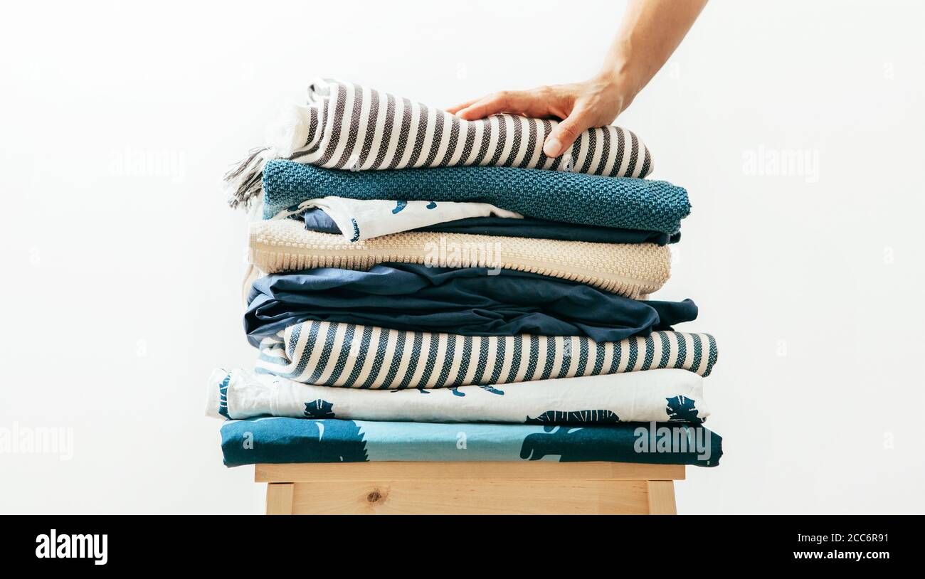 Blue and beige textile laundry for cozy home Stock Photo - Alamy