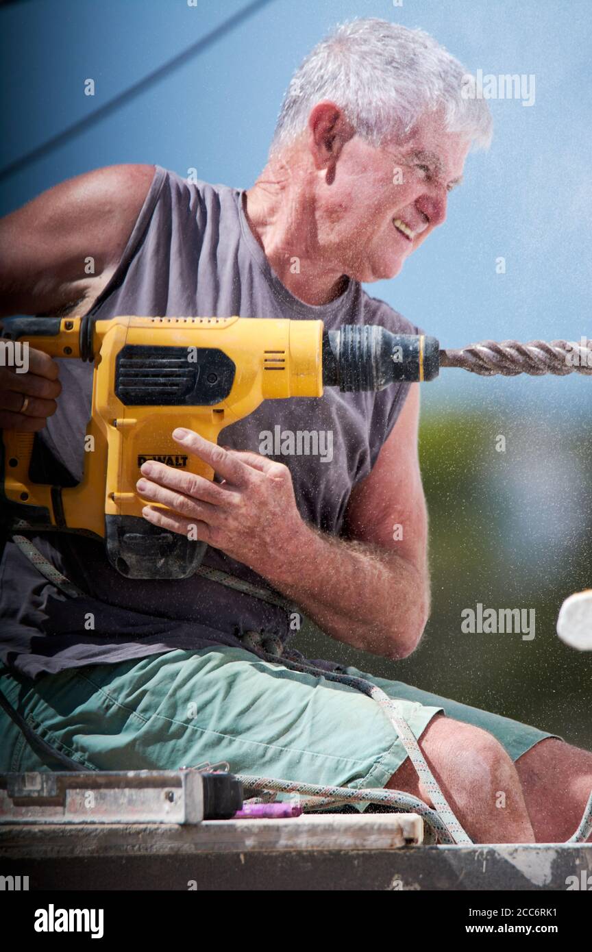 older man doing heavy work Stock Photo - Alamy