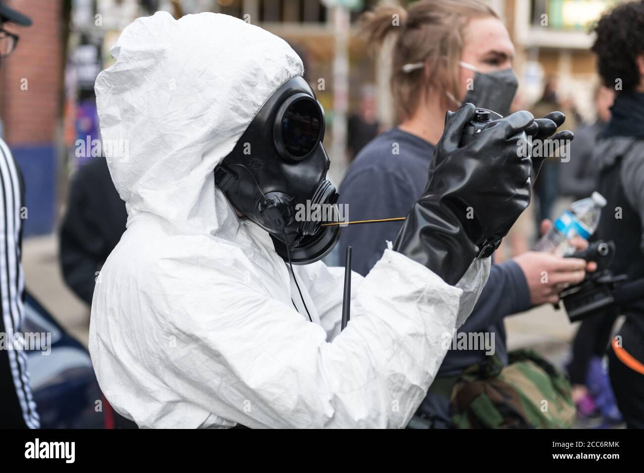 Seattle, USA Jun 4, 2020: A person wearing a bio hazard suit at Chaz ...