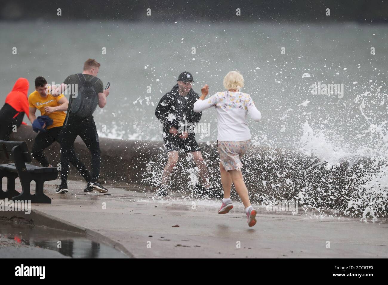 People get hit by a waves crashing on the Front Strand in Youghal, Co ...