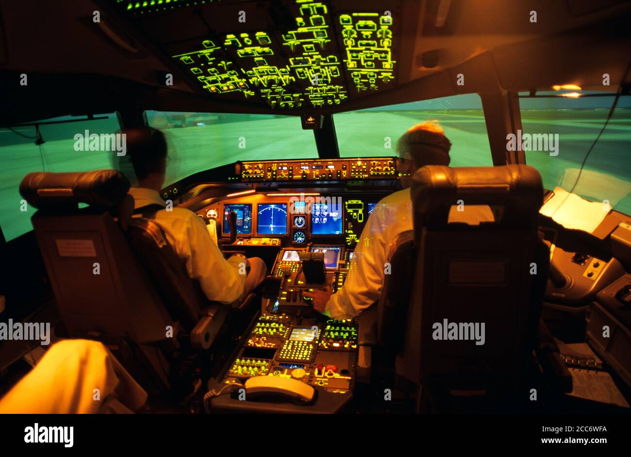 1990s BOEING 777 TWO MEN PILOTS IN FLIGHT SIMULATOR MAN PILOT CREW ...