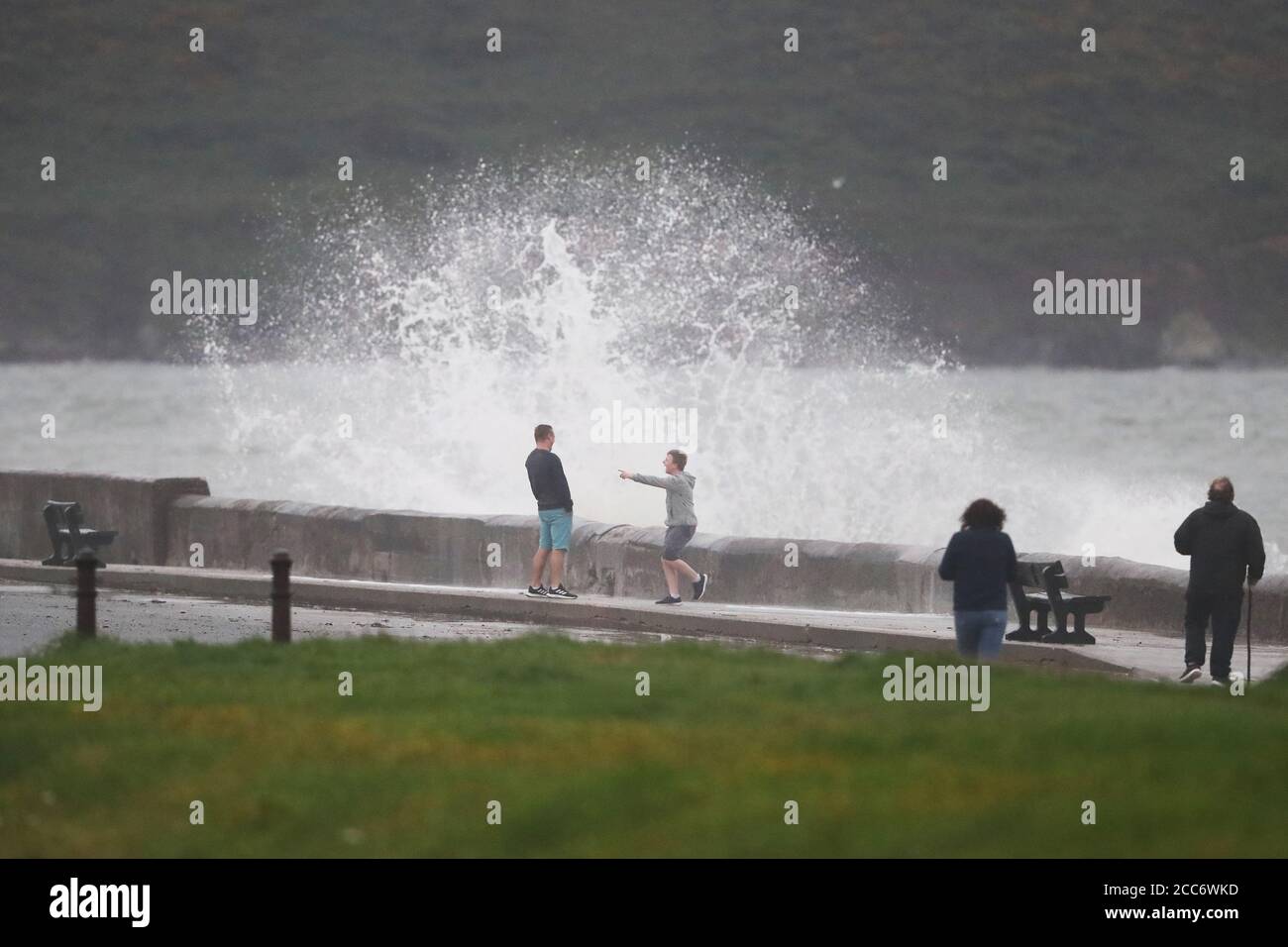 People get hit by a waves crashing on the Front Strand in Youghal, Co ...