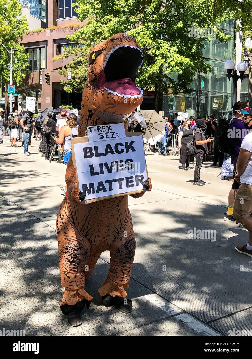 Seattle, USA - Aug 9, 2020: Counter Protestor T-rex at Back the blue ...