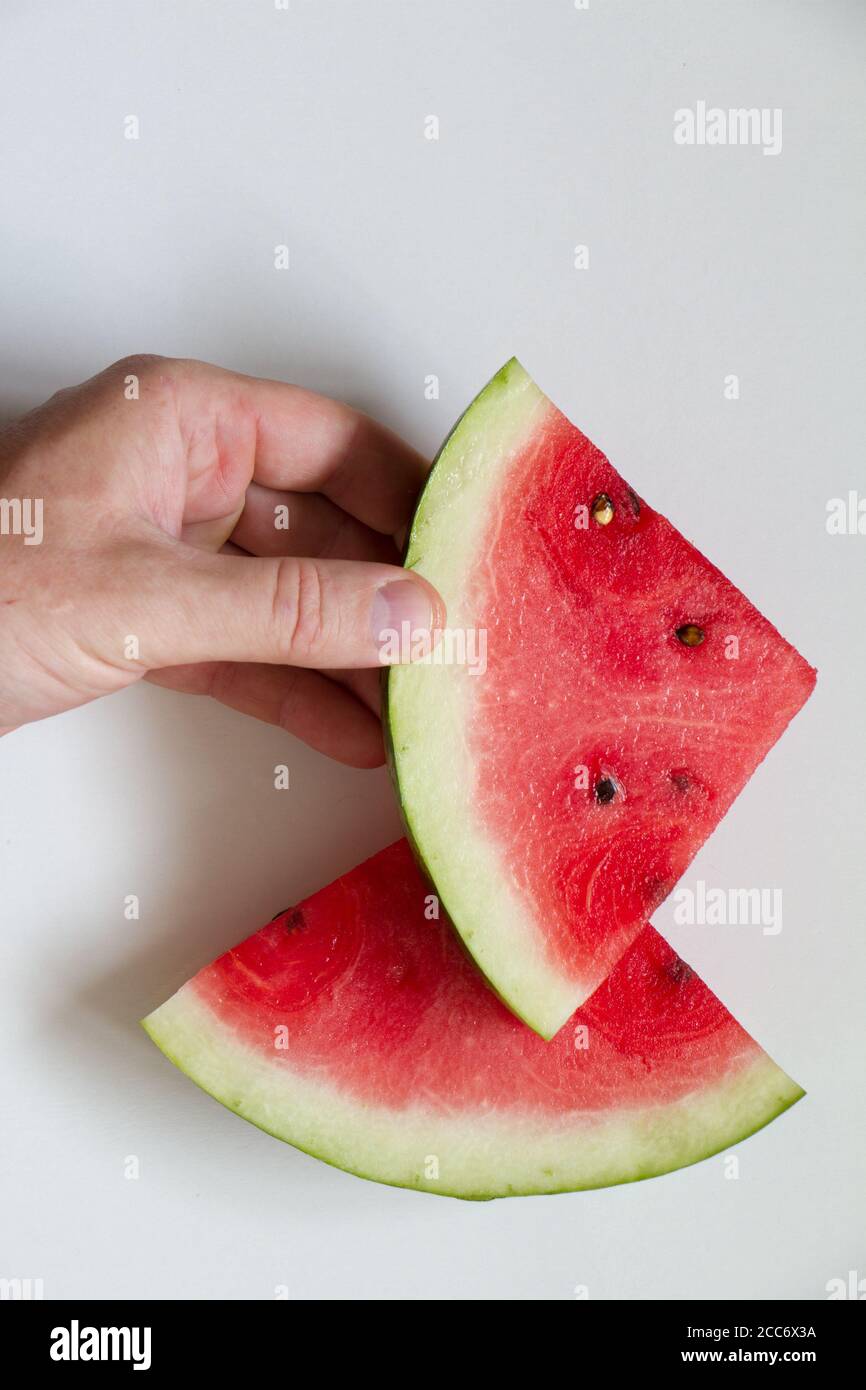 Male hand holding fresh watermelon hi-res stock photography and images ...
