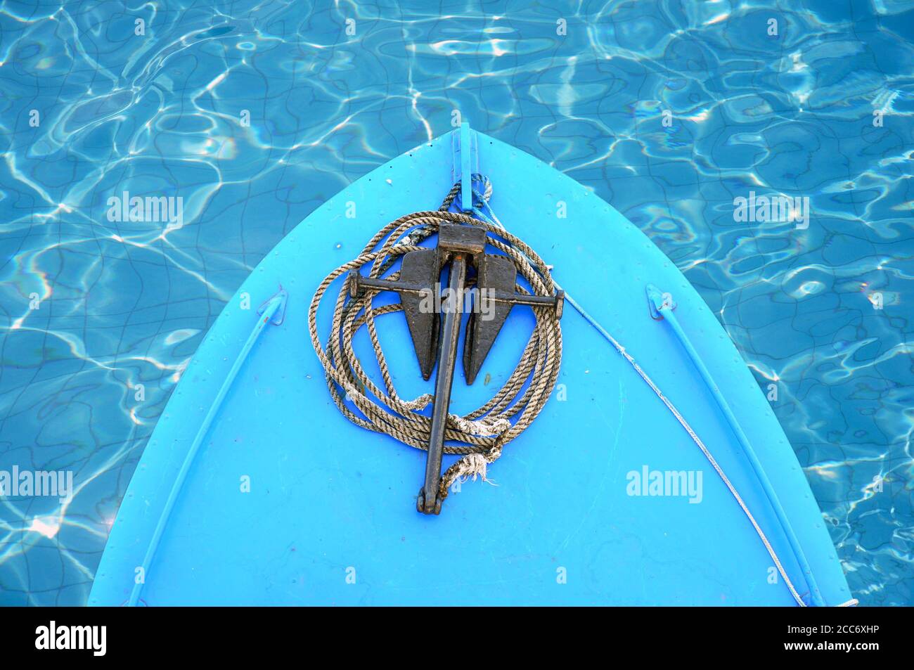 The bow of a boat floating on water with an anchor close-up Stock Photo ...