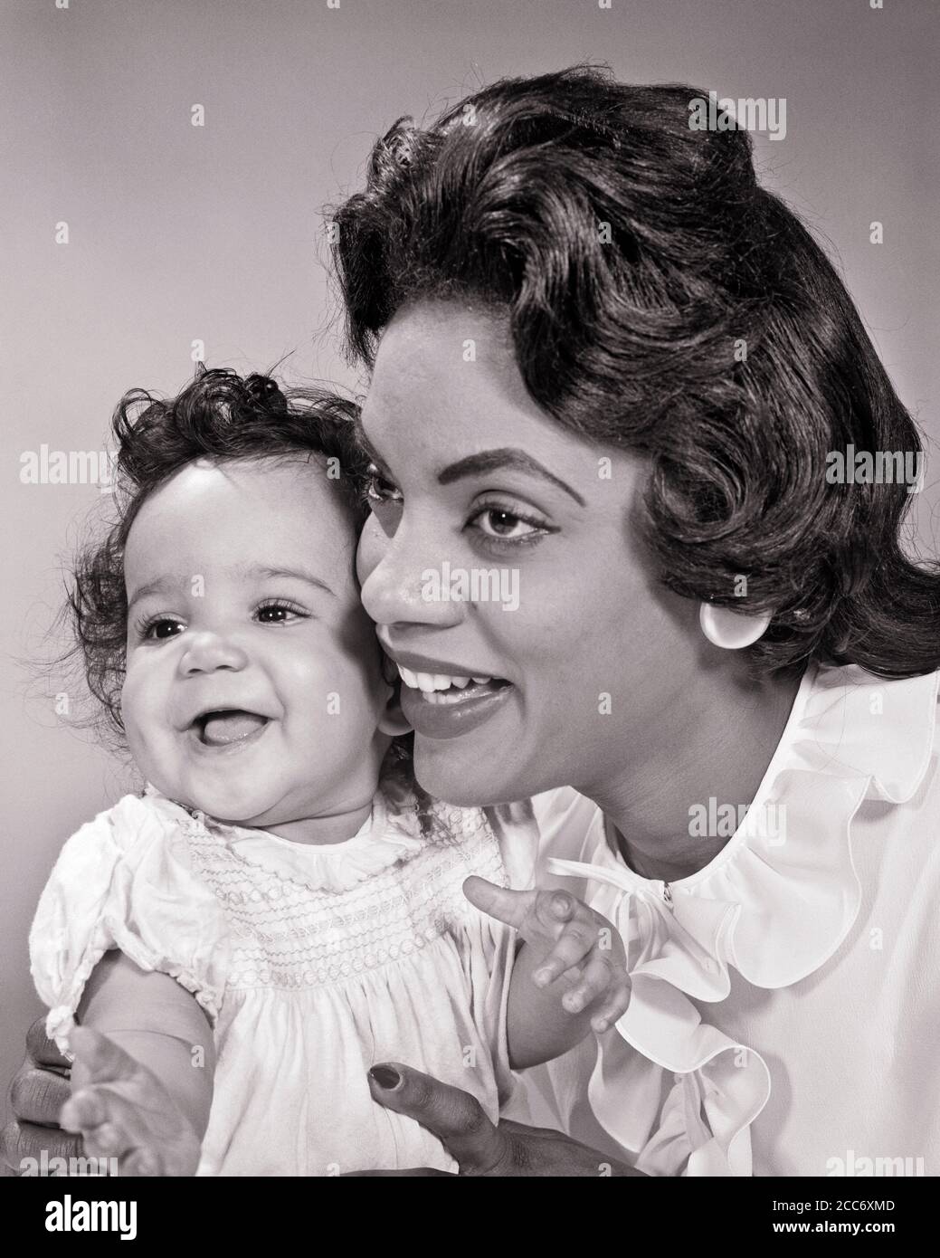 1960s SMILING AFRICAN-AMERICAN WOMAN MOTHER POSING CHEEK TO CHEEK WITH ...