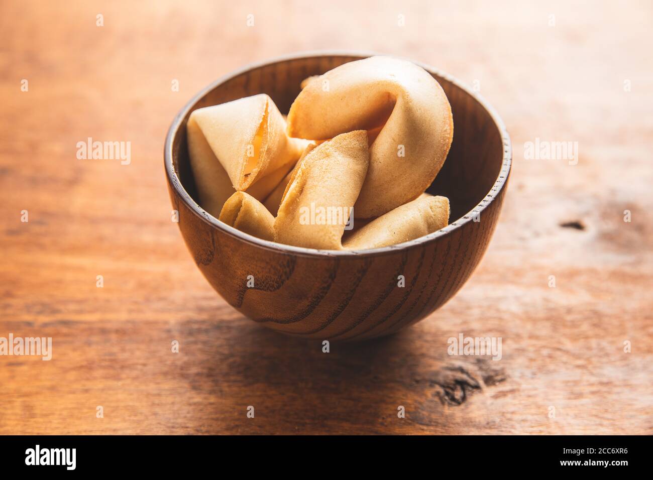 Chinese lucky cookies. Fortune cookies in wooden bowl Stock Photo - Alamy