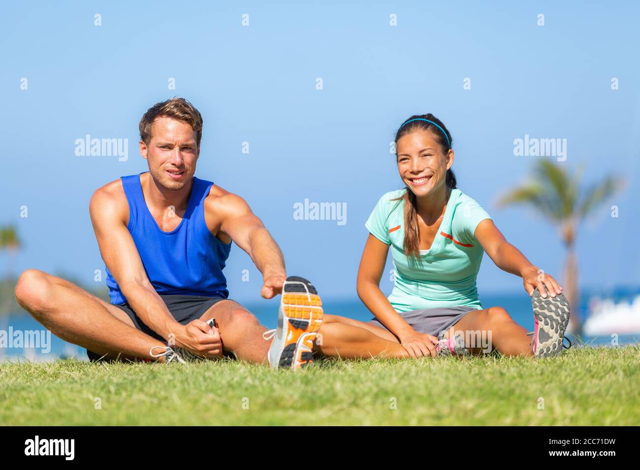 Stretching happy runners group doing leg stretch together on run class ...