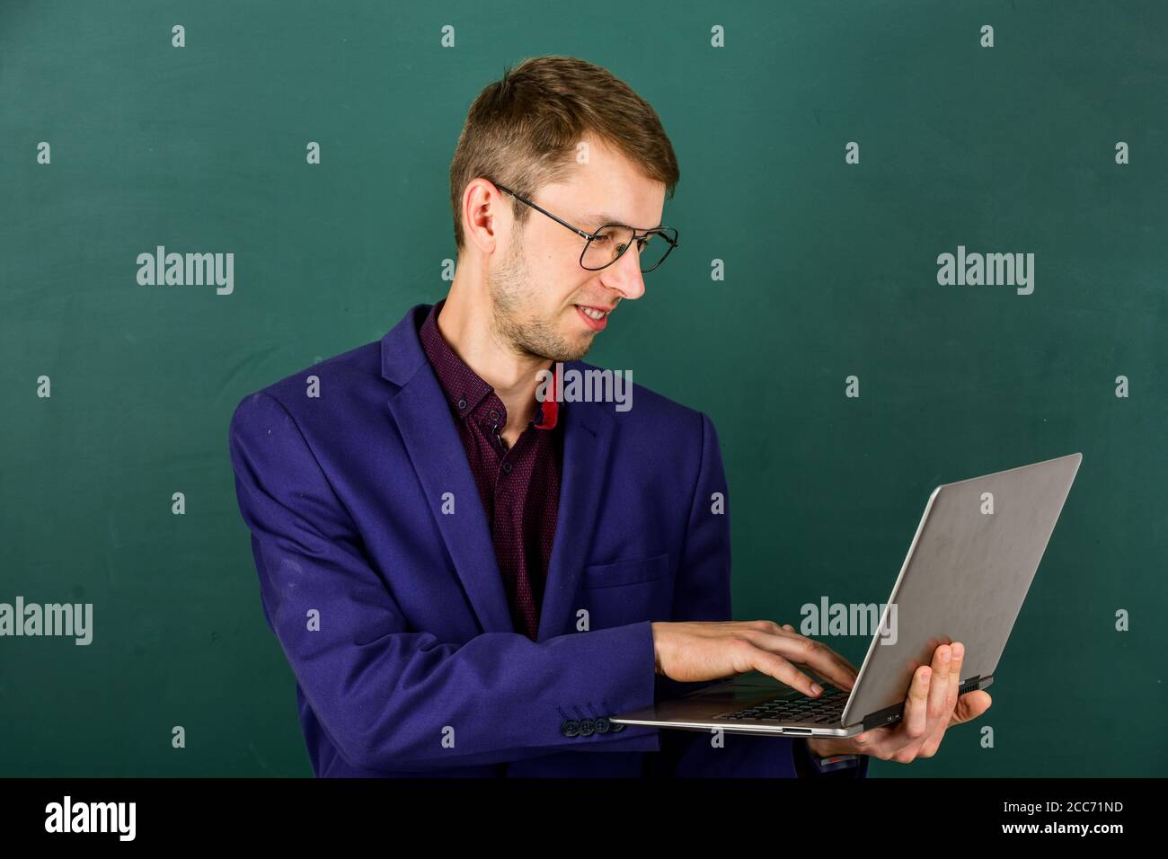 Teacher using modern software self education, preparing for lesson ...