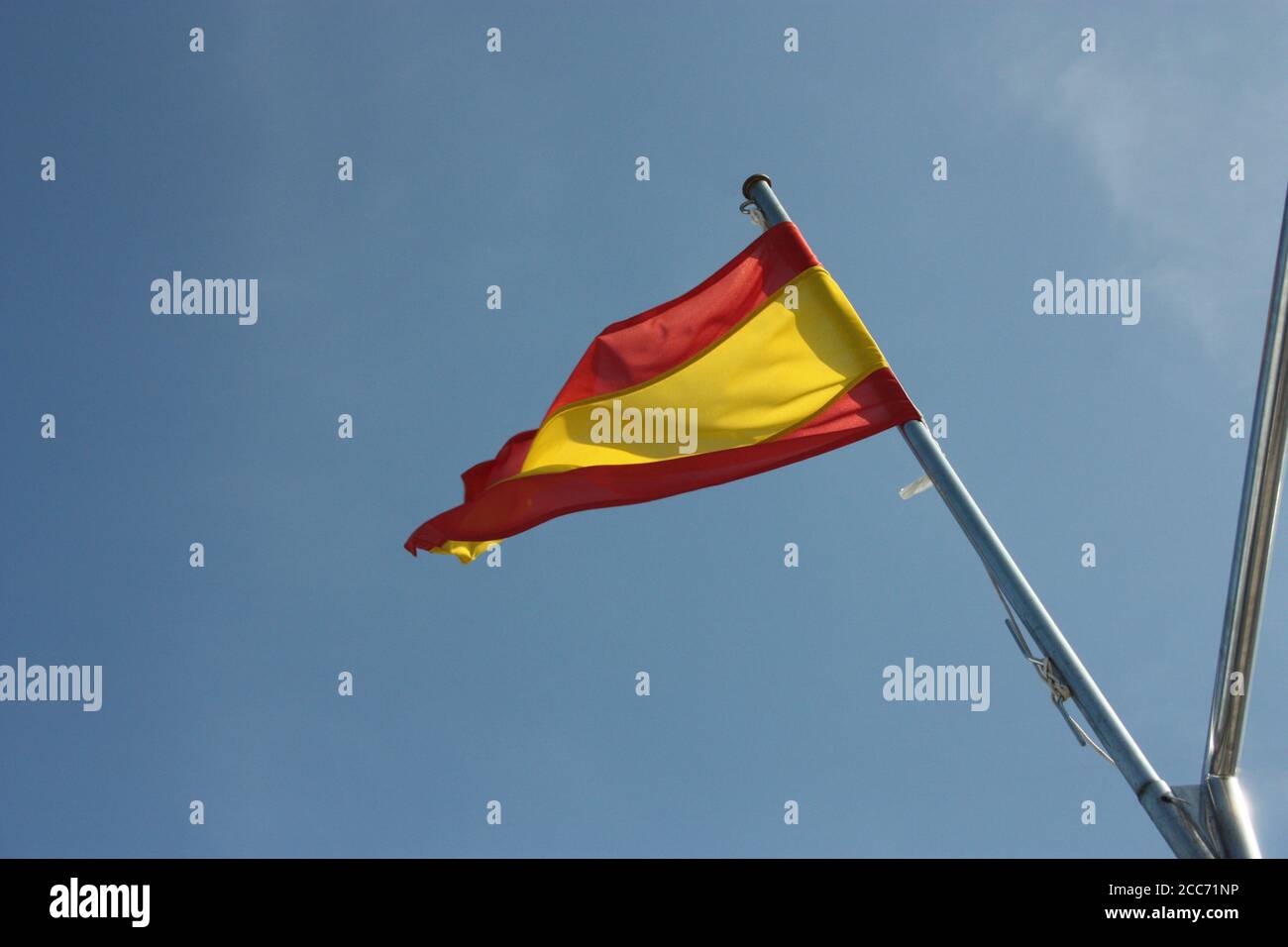 typical Spanish national flag in red and yellow horizontal bands ...
