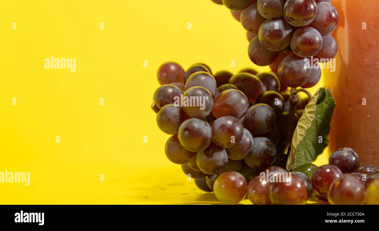 Bunches of pink grape. Fruit juice. Energetic and refreshing drink ...