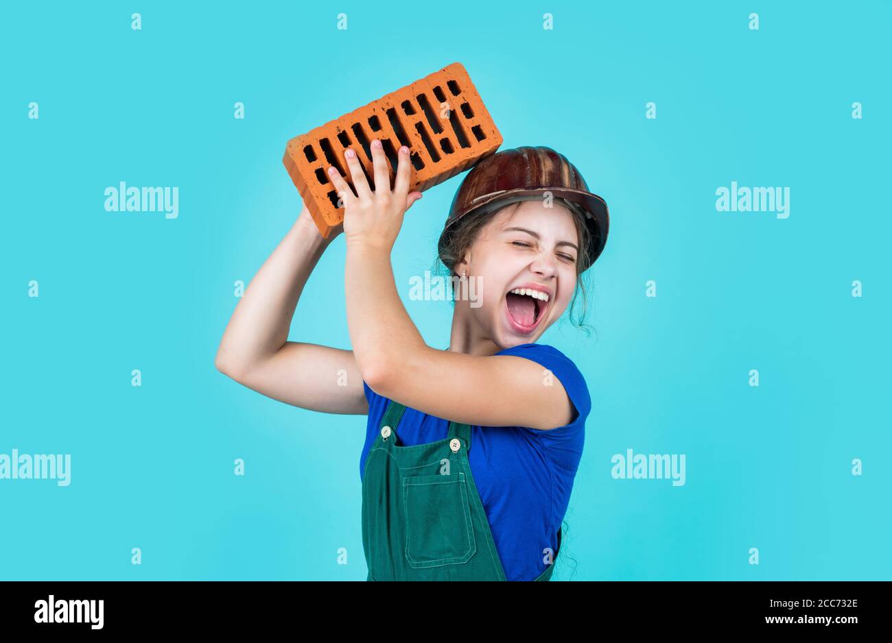 oh no. Little girl bricklayer. learning how to build. Little worker in ...
