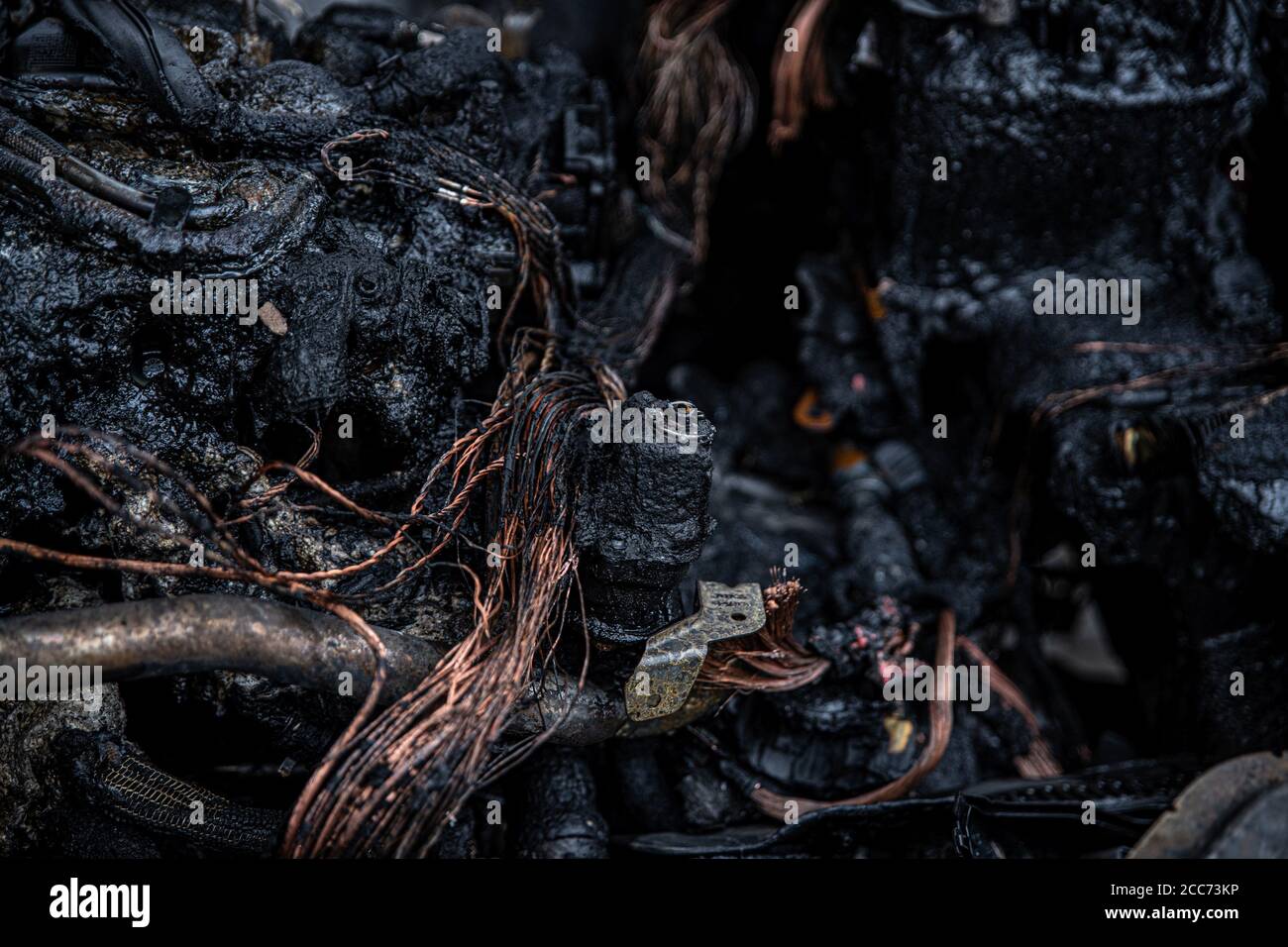 Destroyed car after fire. Burnt modern car engine Stock Photo - Alamy