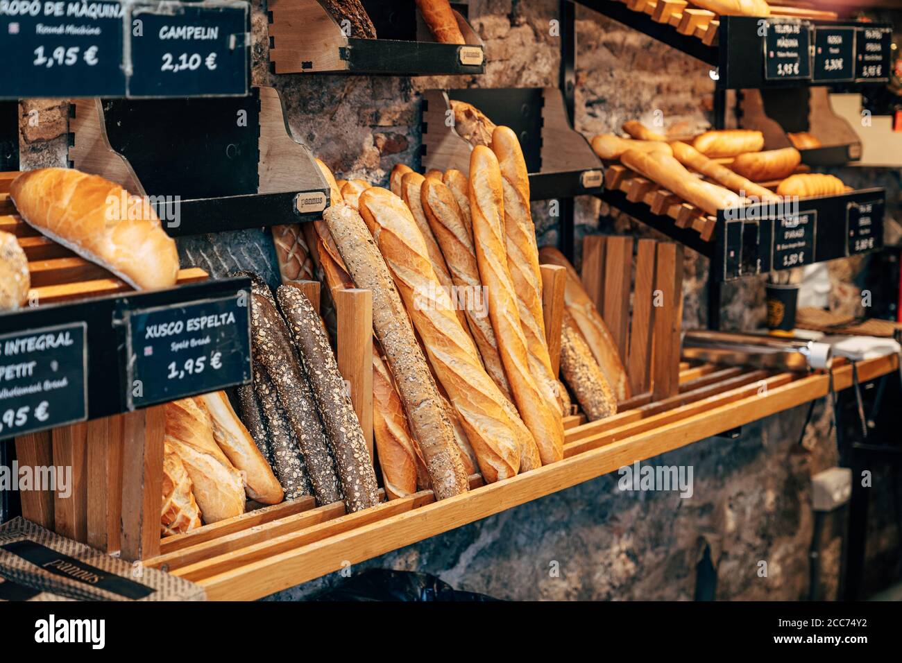 Bread shop showcase. Various loaves of bread on the shelves in the ...