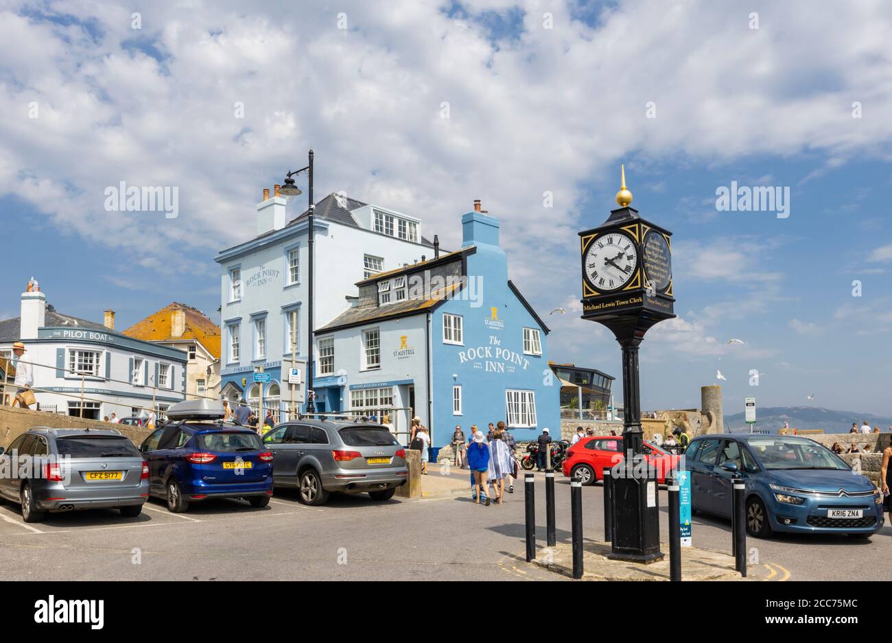 The Rock Point Inn and Town Clock on the seafront at Lyme Regis, a ...