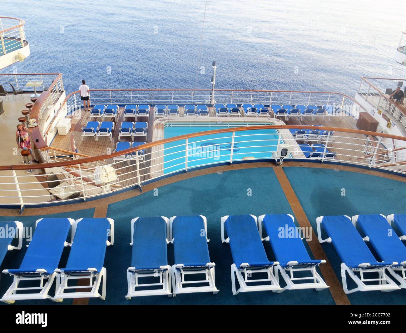 Empty deck chairs and swimming pool on a cruise ship Stock Photo - Alamy