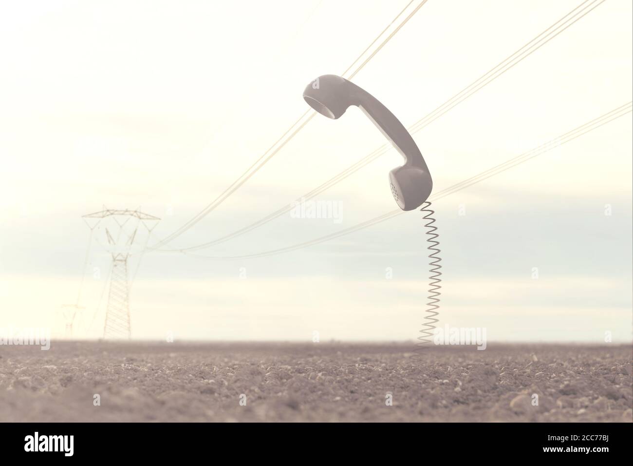 surreal image of a giant phone connected to the ground Stock Photo - Alamy