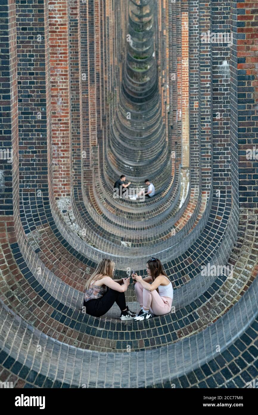 Young people under the Ouse Valley Viaduct (Balcombe Viaduct) carrying ...