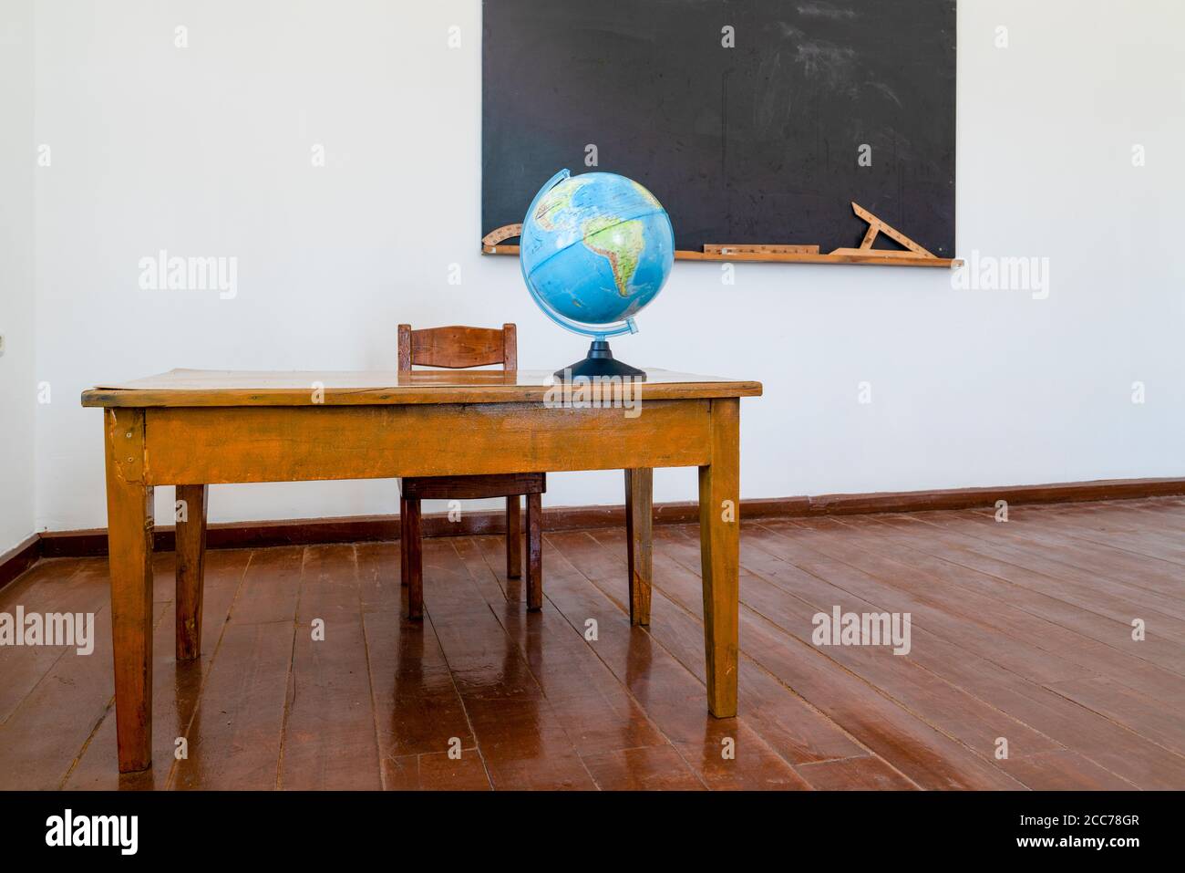 For the geography lesson, the globe stands on the teacher's desk. Tools ...