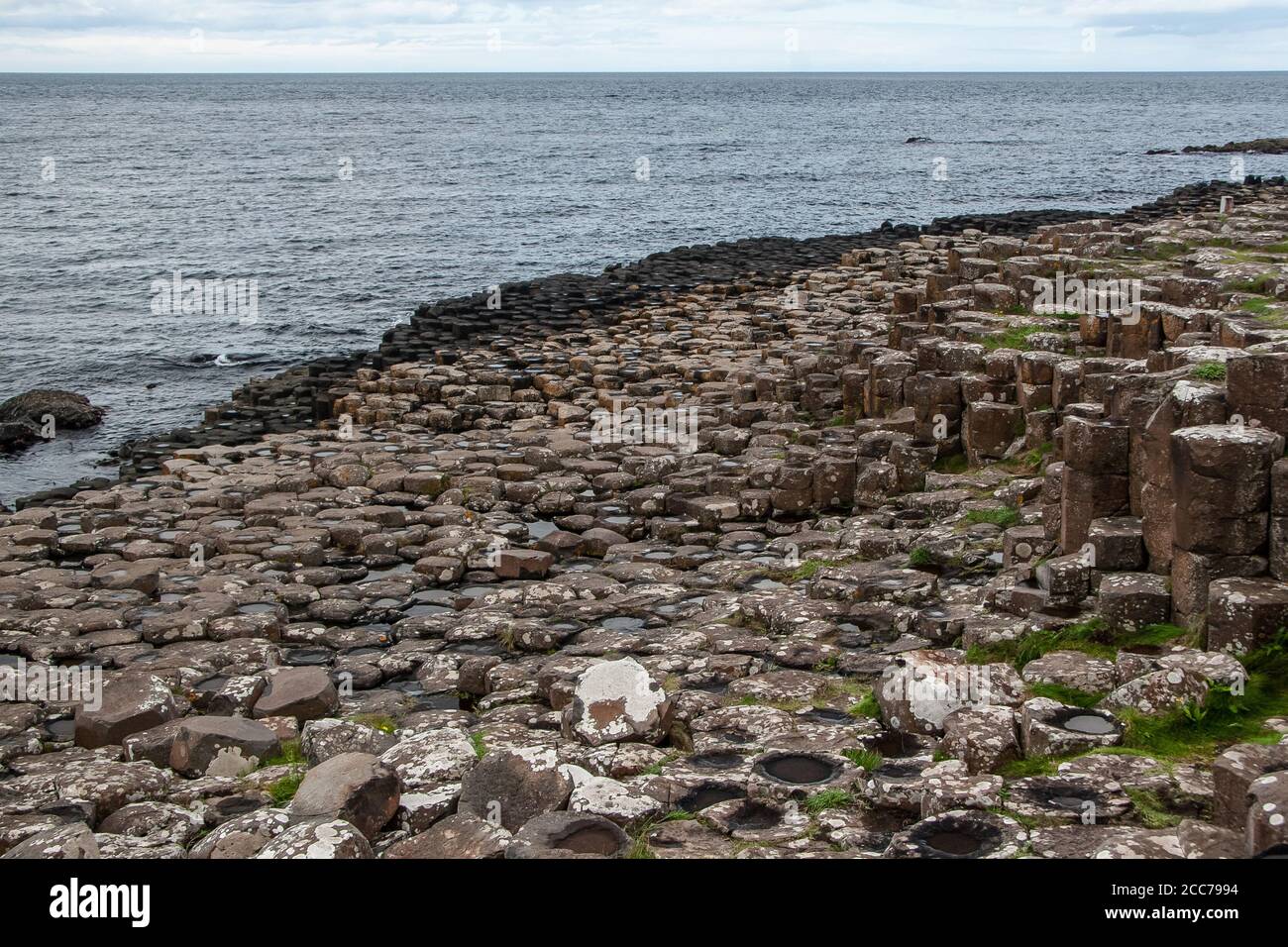 Hexagonal stone columns formations, sea in background, at Giant's ...