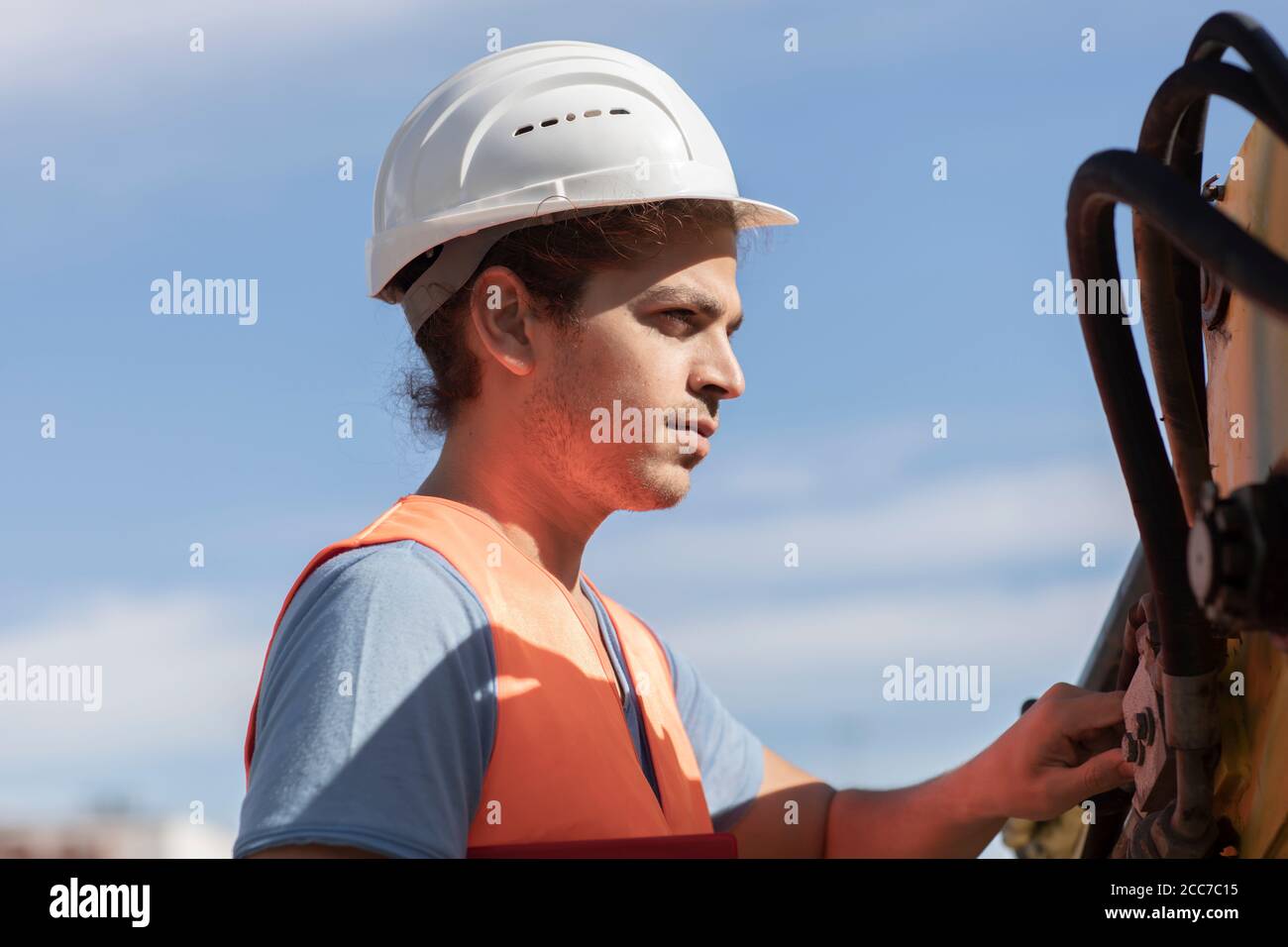 young engineer working outside at photo voltaic station Stock Photo - Alamy