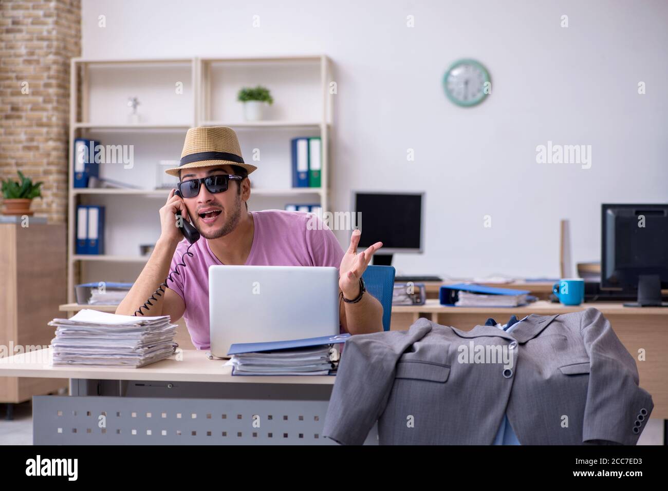 Young employee preparing for the trip Stock Photo - Alamy
