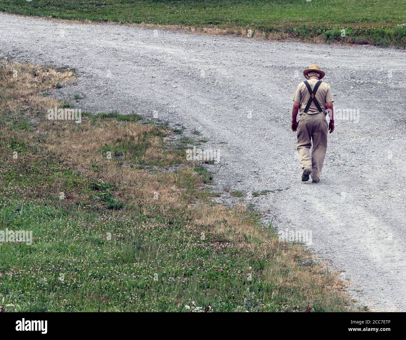 Man walking down country lane hi-res stock photography and images - Alamy