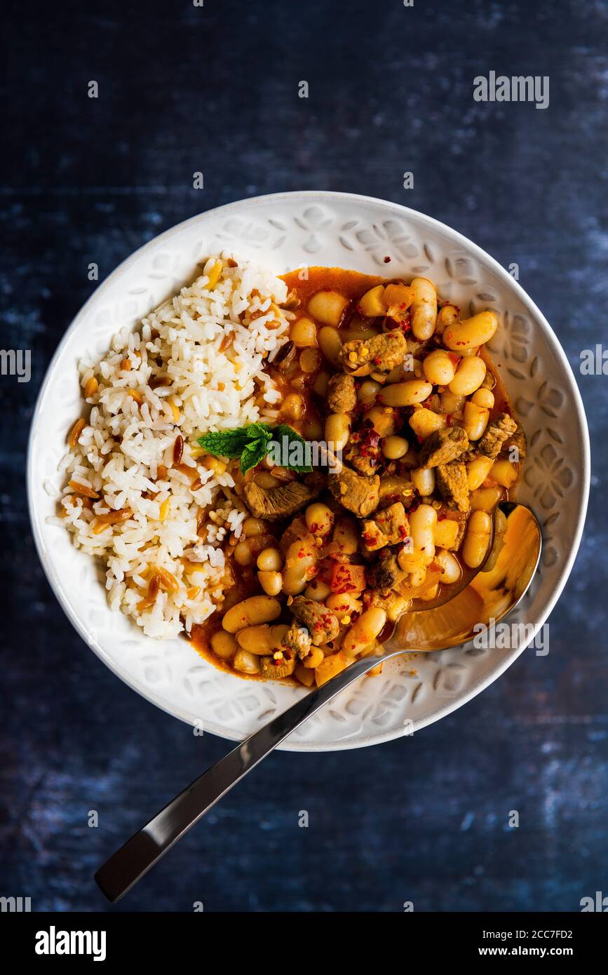 Turkish white bean stew with lamb called kuru fasulye served with orzo ...
