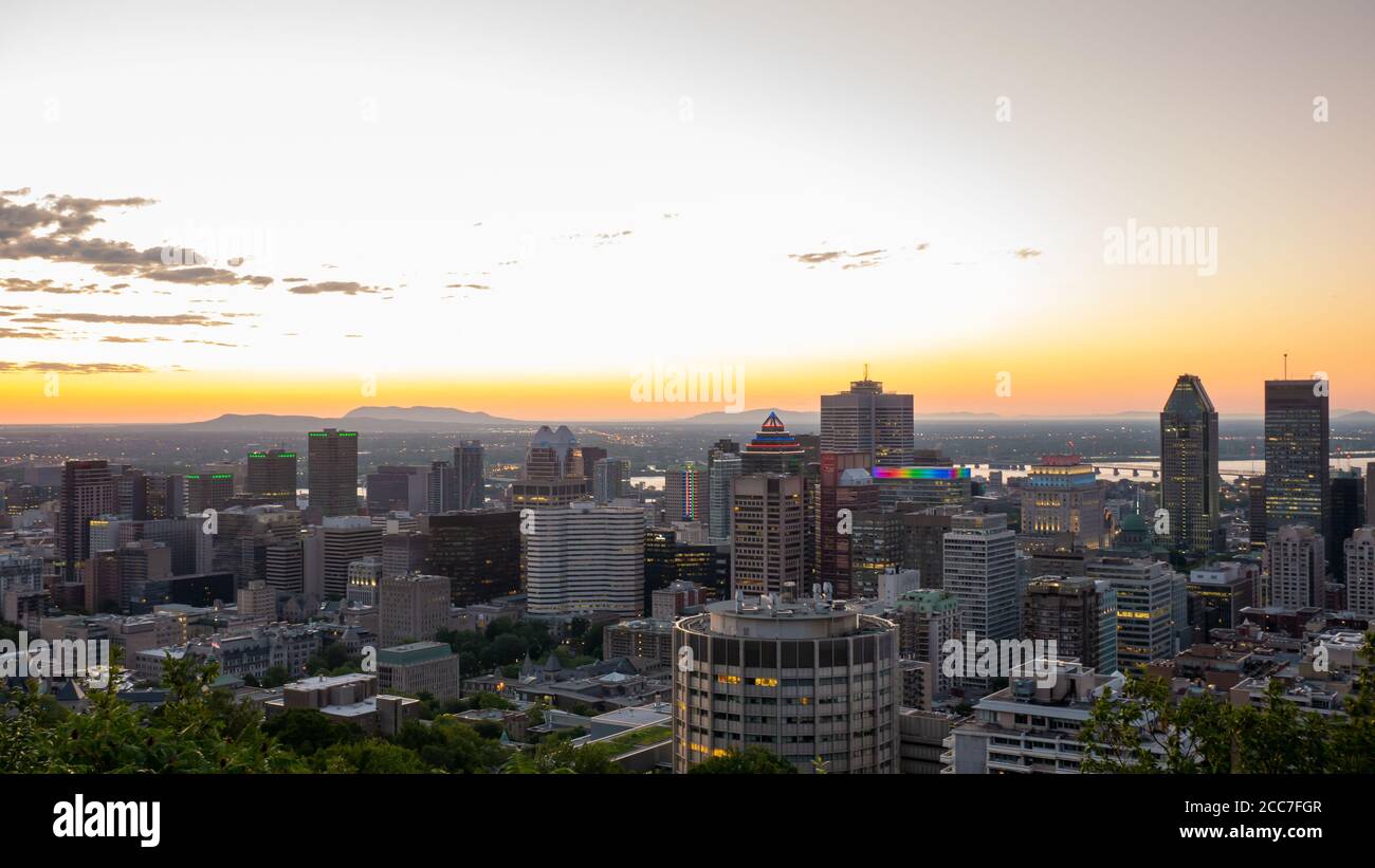 Montreal sunrise viewed from Mount Royal with city skyline in the ...