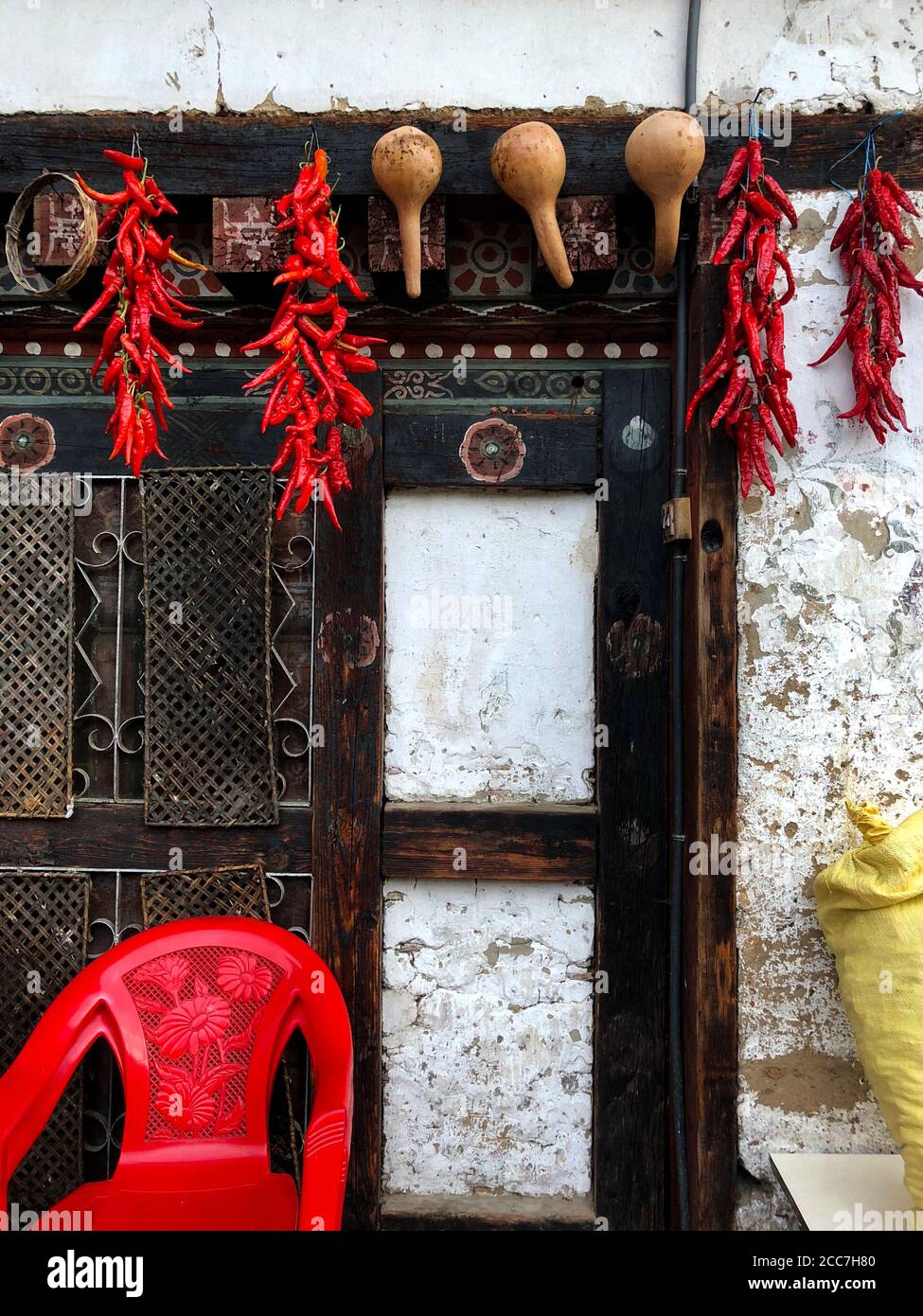 Red Chilli Peppers Hung to Dry Outside a House in Bhutan Stock Photo ...