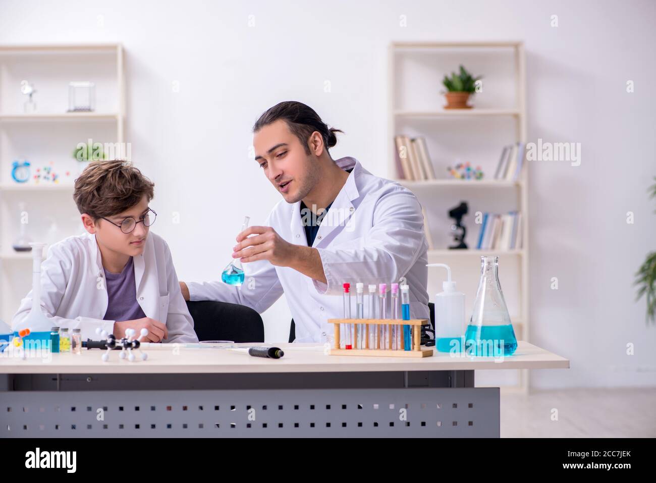 Young father and son chemists in the laboratory Stock Photo - Alamy