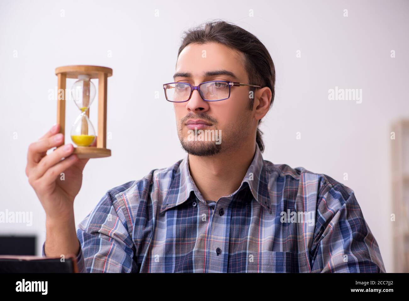 Young student sitting in the classroom Stock Photo - Alamy