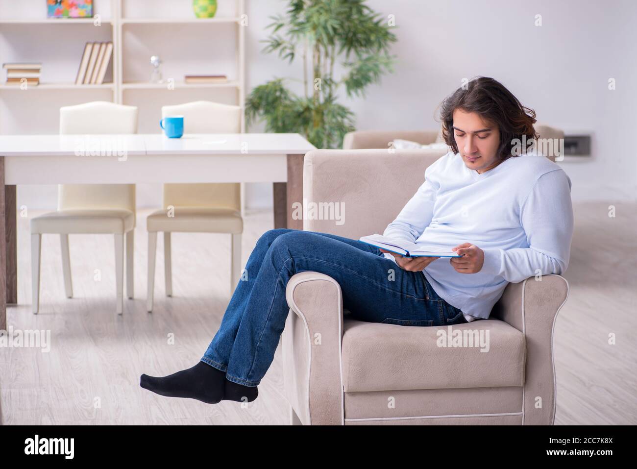 Young student preparing for exams at home Stock Photo - Alamy