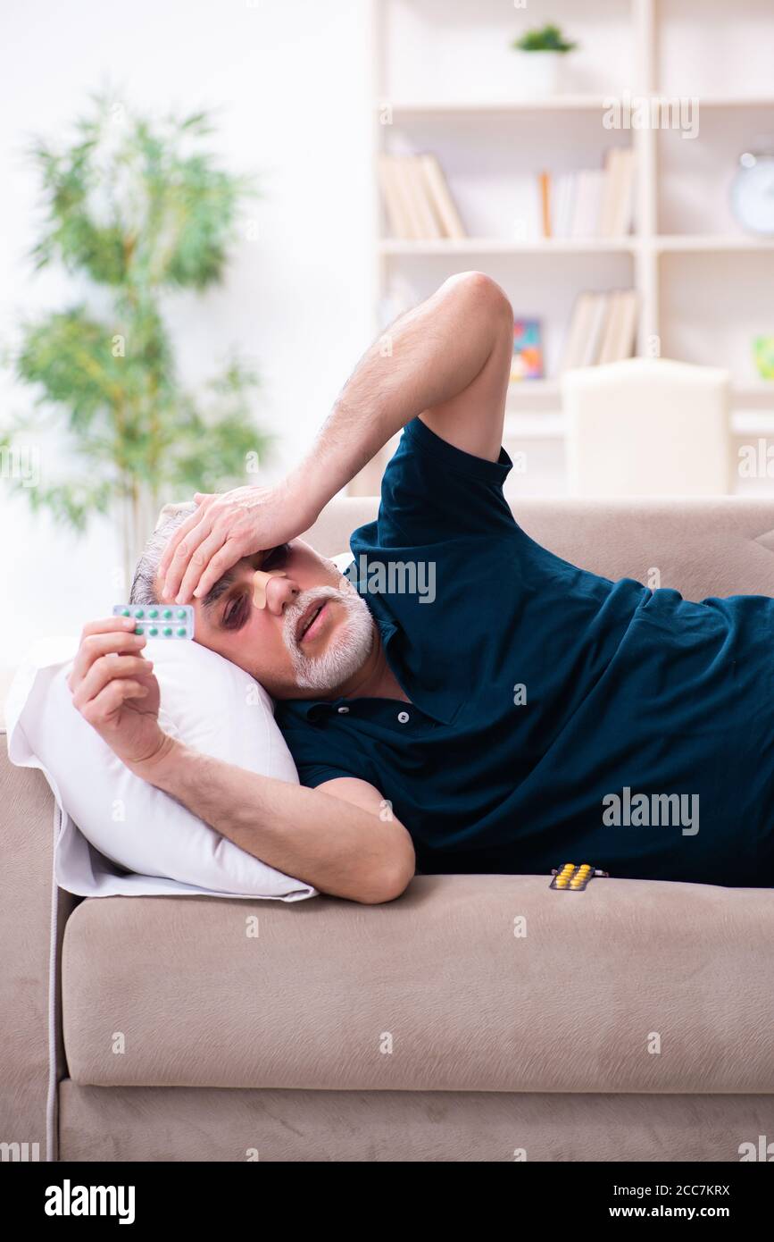 Old man with injured eyes resting at the home Stock Photo - Alamy