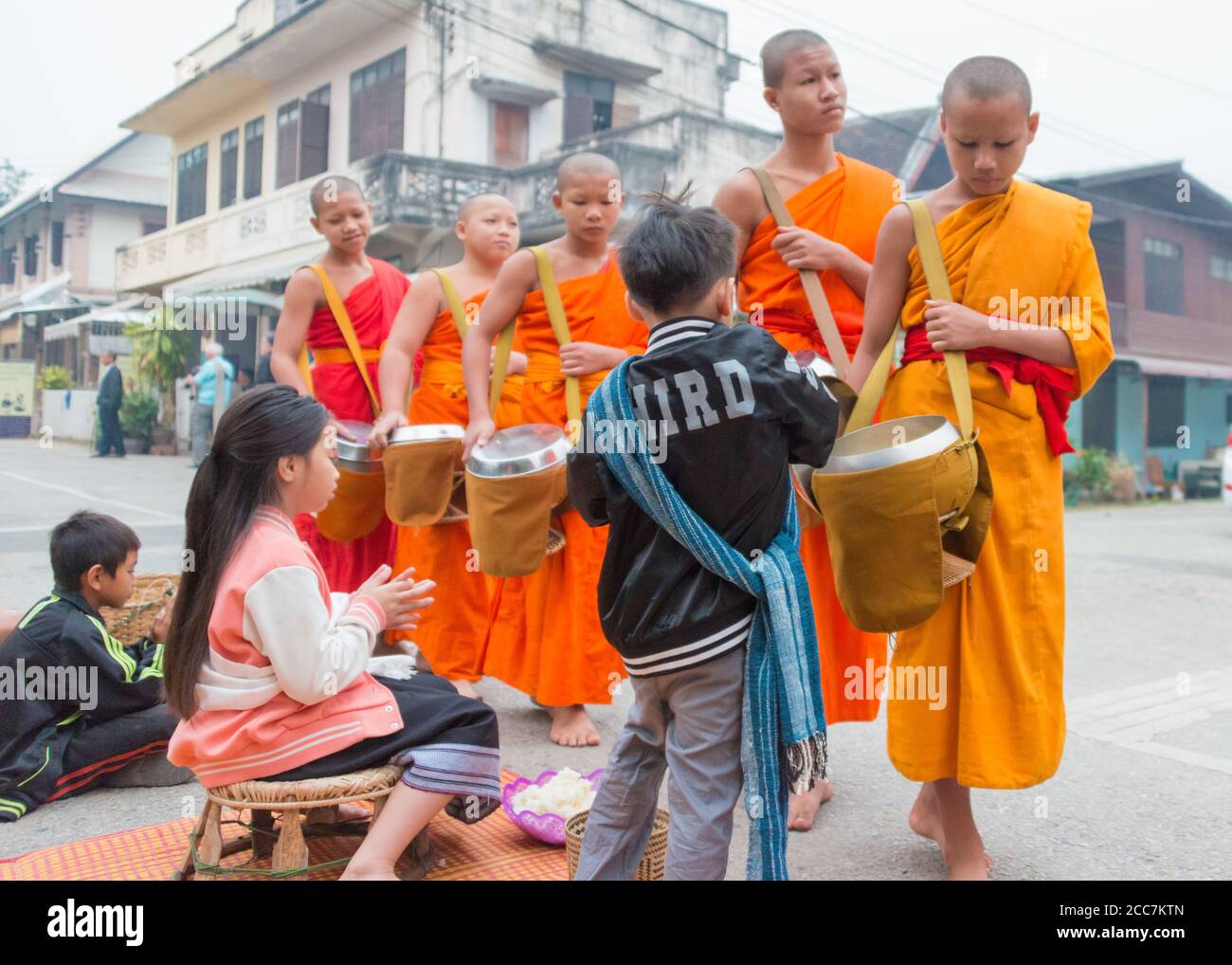 Luang Prabang, Laos - Lao buddhist monks alms giving ceremony on the ...