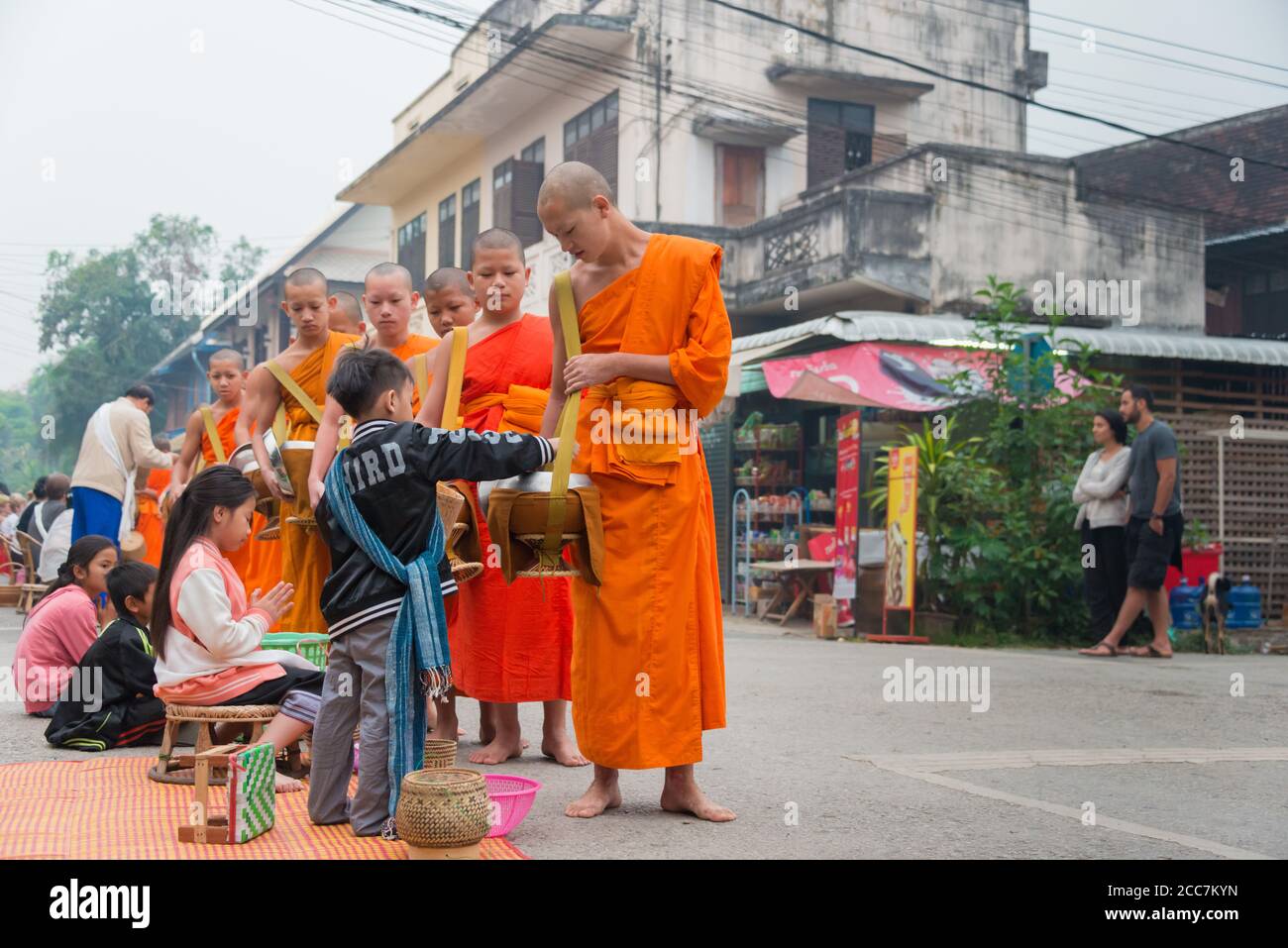 Luang Prabang, Laos - Lao buddhist monks alms giving ceremony on the ...