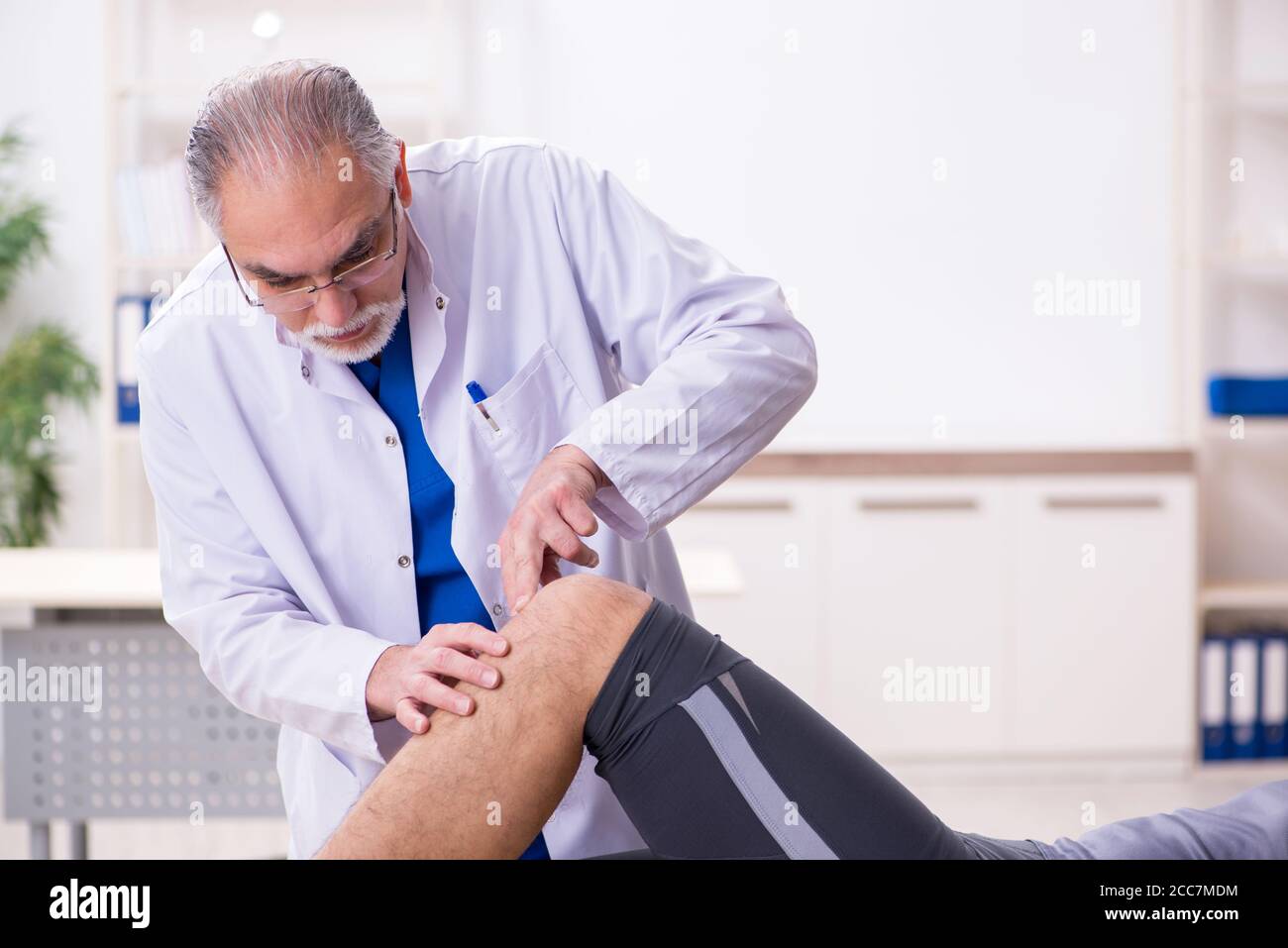 Young male patient visiting doctor traumatologist Stock Photo - Alamy