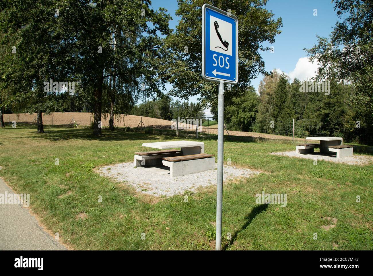 motorway rest area with tables and benches, in the foreground there is ...