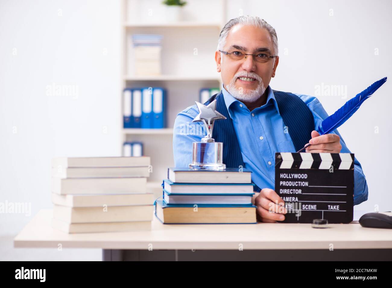 Old male author writing the screenplay Stock Photo - Alamy