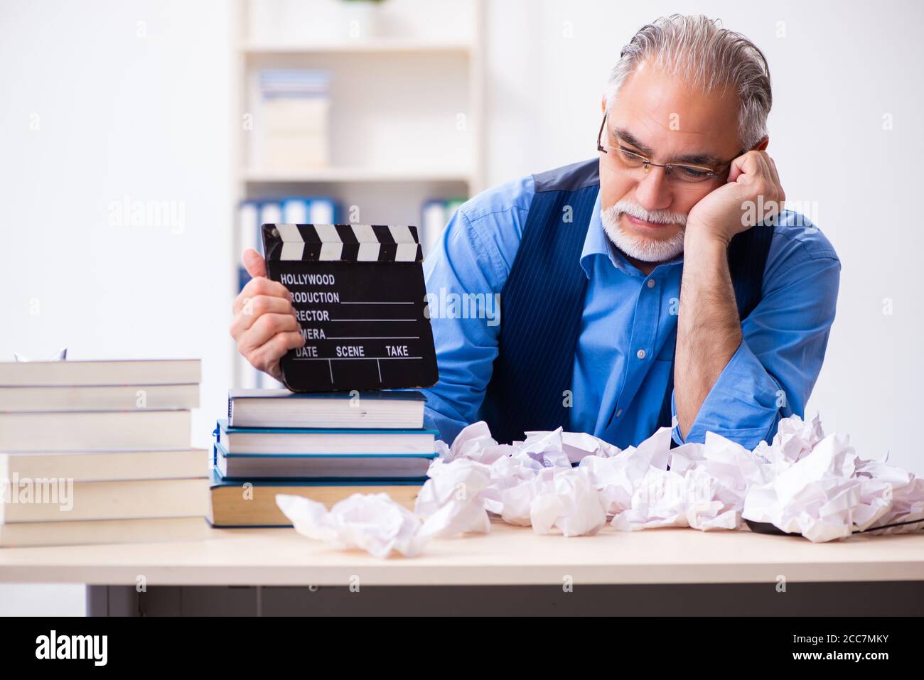 Old male author writing the screenplay Stock Photo - Alamy