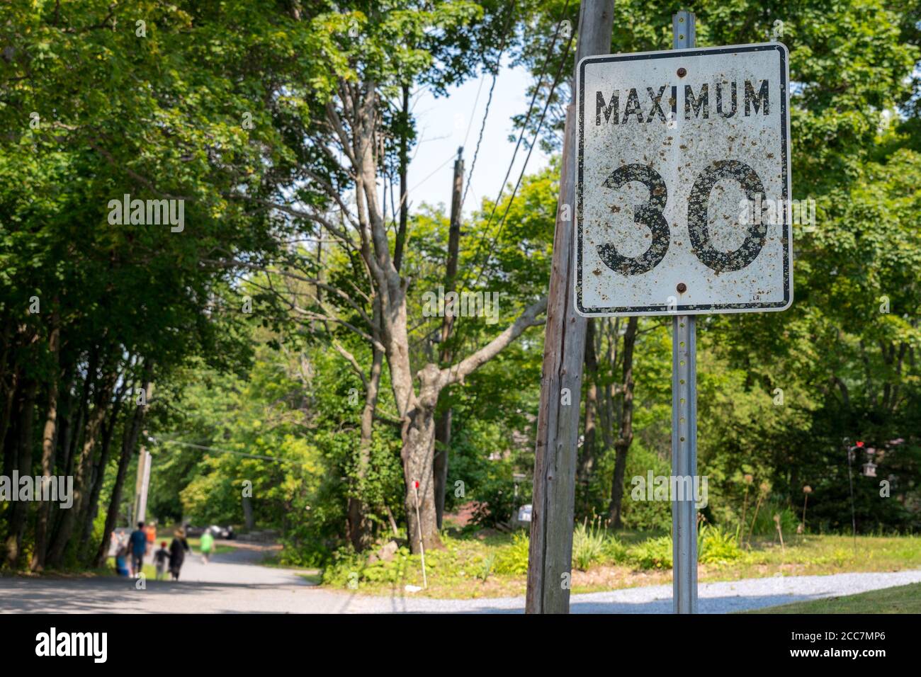 An old seed limit sign that says "MAXIMUM 30". The sign is covered with ...