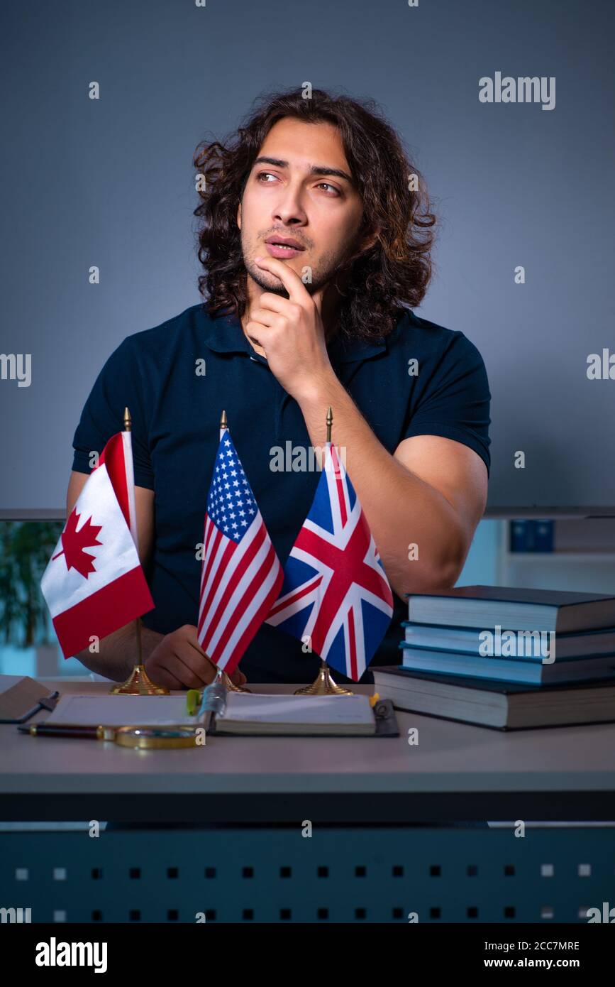 Young student in the classroom at night Stock Photo - Alamy