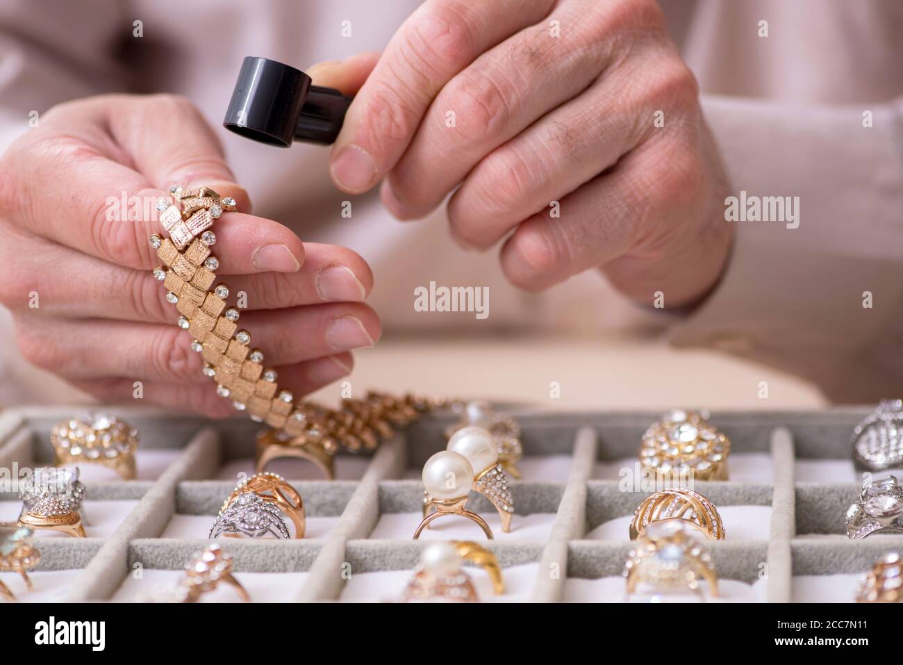 Old jeweler at the workshop Stock Photo - Alamy