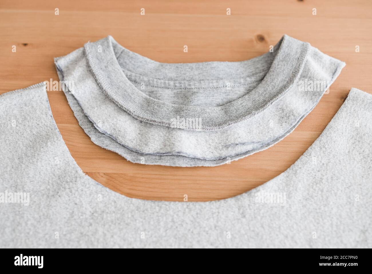 fashion diy and upcycling old clothes concept, sweatshirt with scissors ...