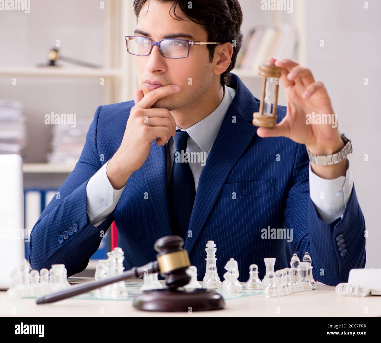 The young lawyer playing chess to train his court strategy and tacti ...