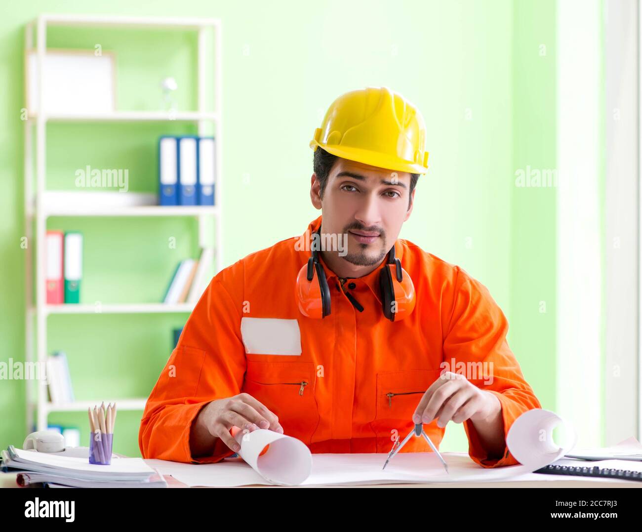 The construction supervisor planning new project in office Stock Photo ...