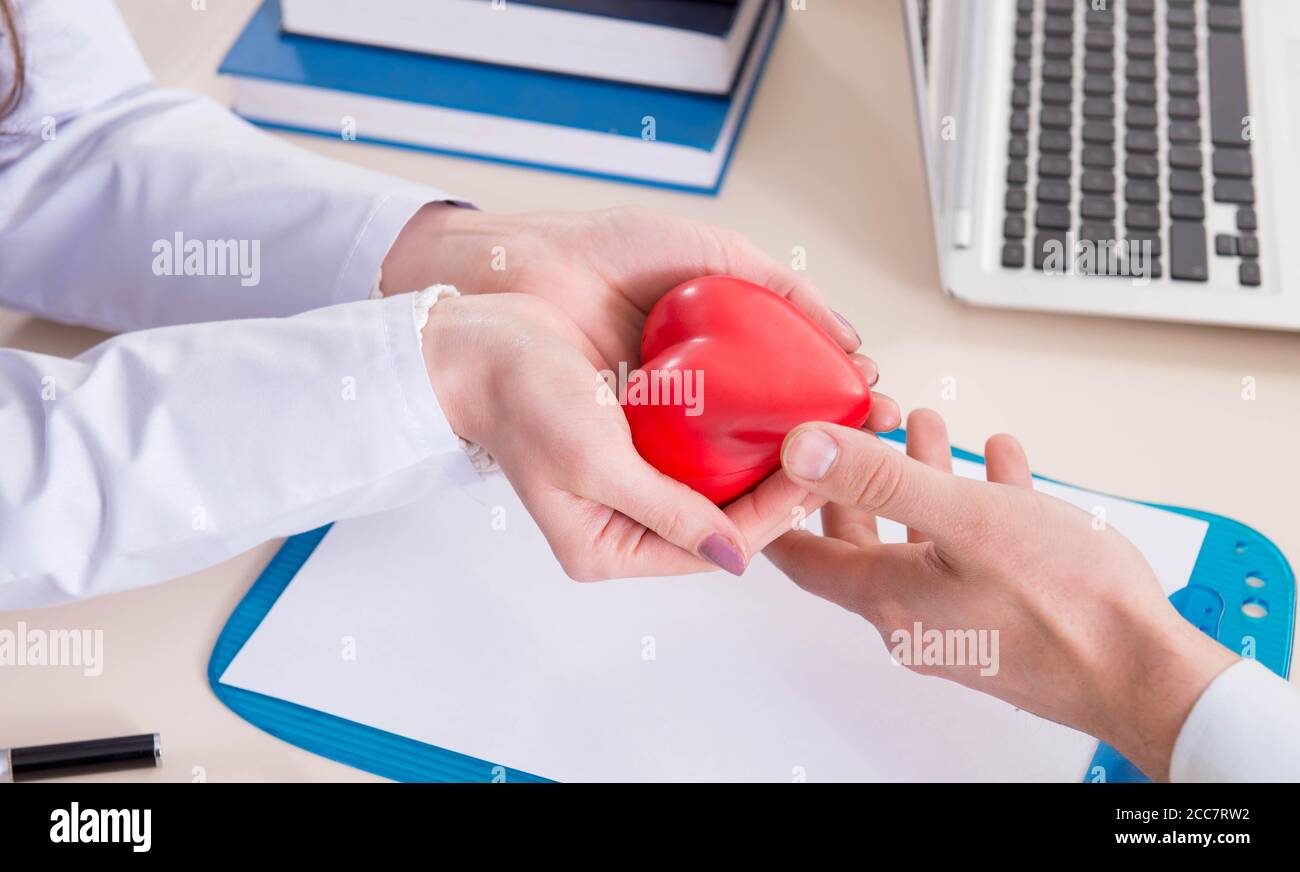 The businessman visiting cardiologist for routine check-up Stock Photo ...