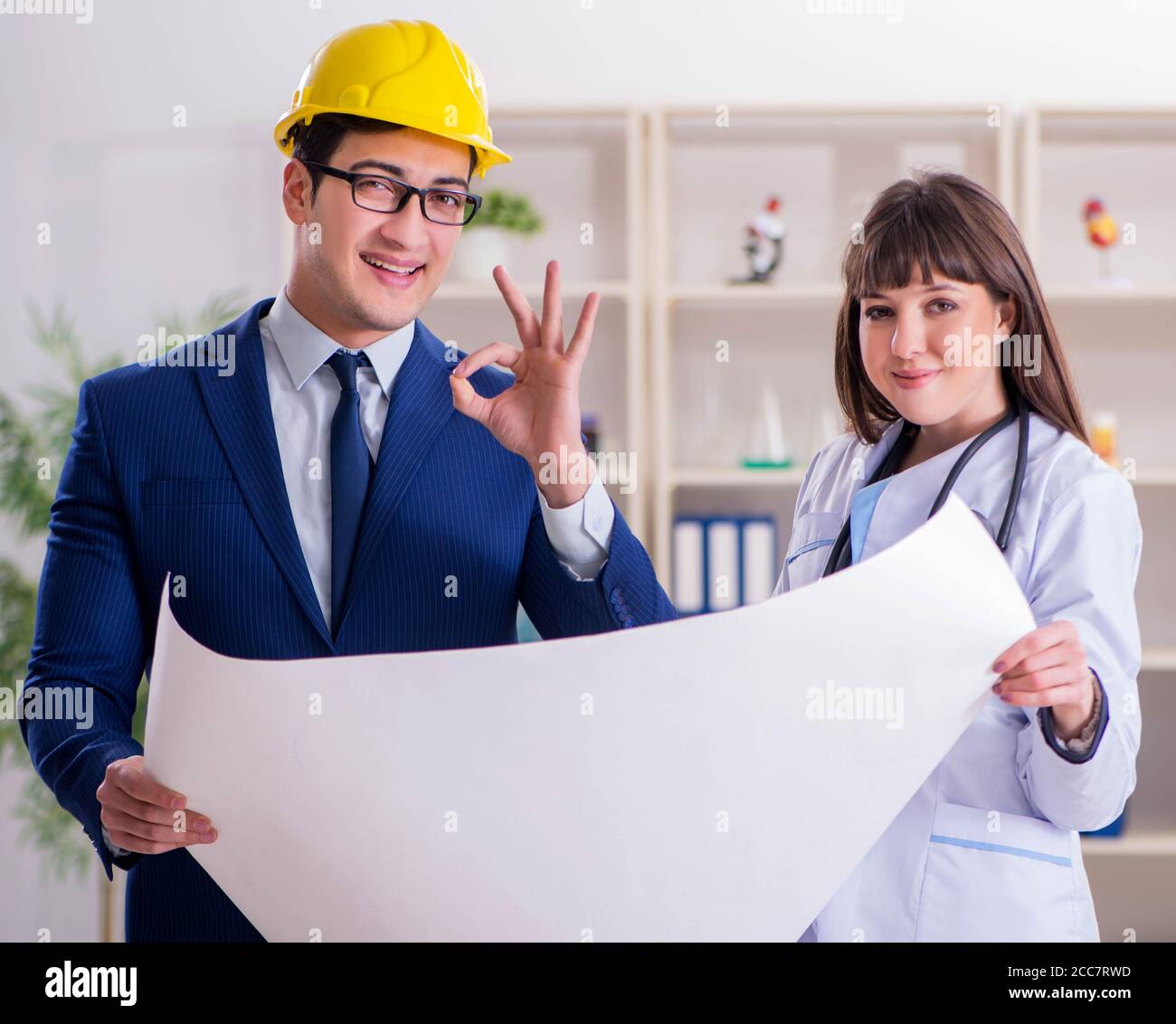 The doctor discussing new hospital plan with architect Stock Photo - Alamy