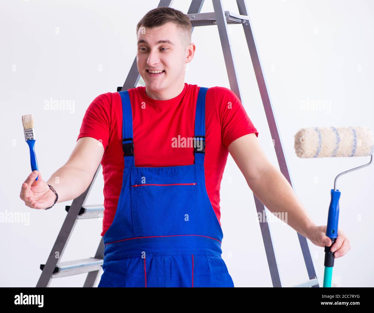 The male painter preparing for painting job at construction site Stock ...