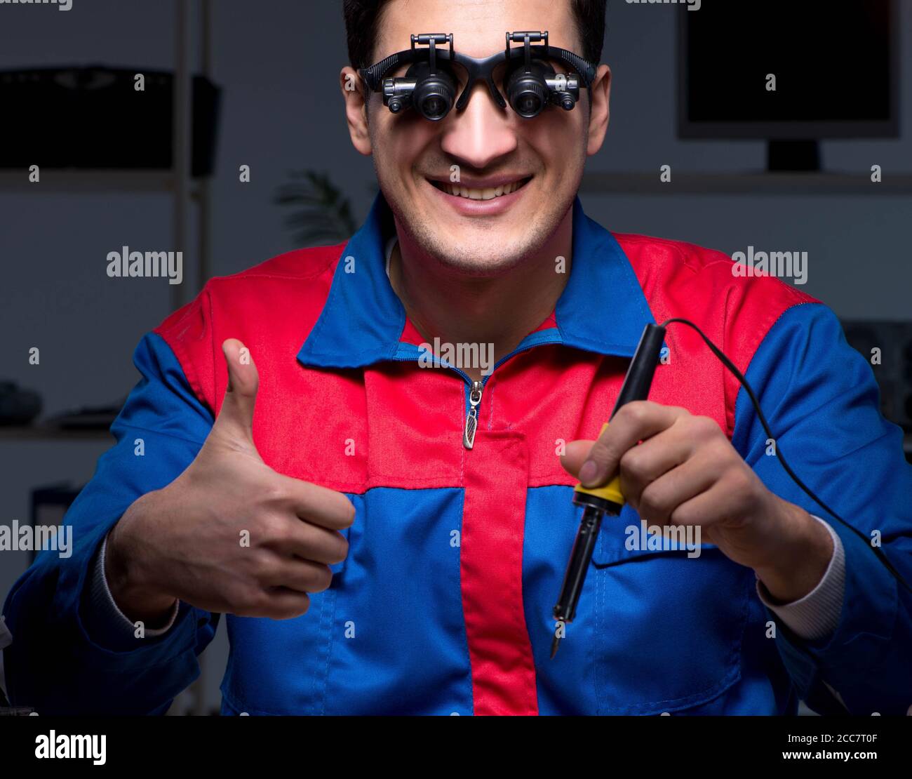 The computer specialist repairing pc late at night Stock Photo - Alamy